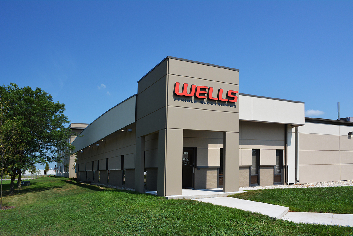 Wells corner w sign0211 - The Norwood Company